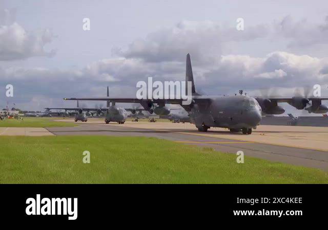 World War II style aerial transports taxing on a runway for the 75th D ...