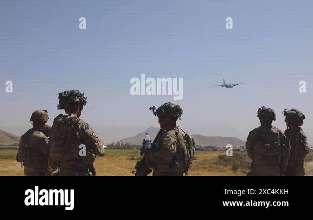2021 - Afghan refugees are ushered onto planes by U.S. soldiers at ...