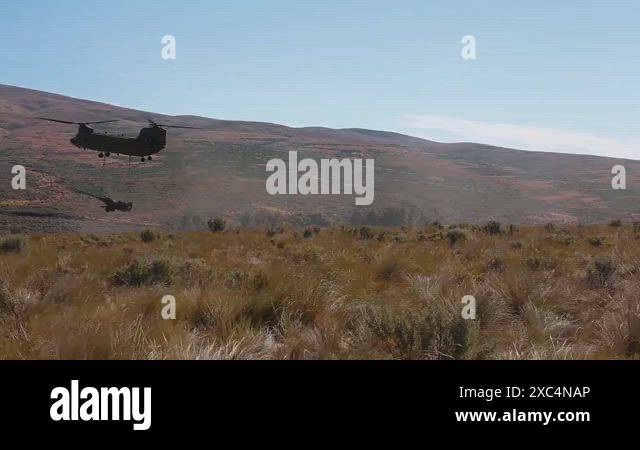 2010s - A US Army helicopter drops off a piece of field artillery ...