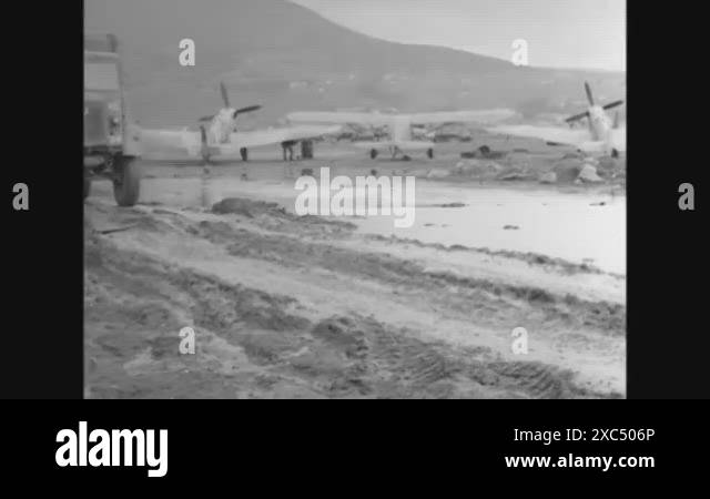 1944 - shots on flooded airfield in Florence, truck passing by ...