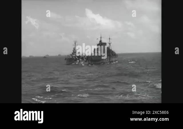 1944 - American servicemen load guns on US Navy ships and fire on the ...