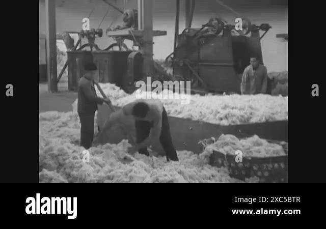 1944 - Scenes inside a Chinese cotton spinning factory, where men pack ...