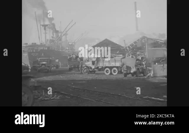 1950 - Trucks drive by during the evacuation of Hungnam loaded with ...