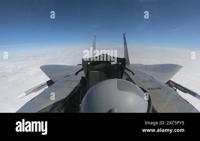 2020 -Dramatic aerial of F-15 fighter aircraft during a mid-air ...