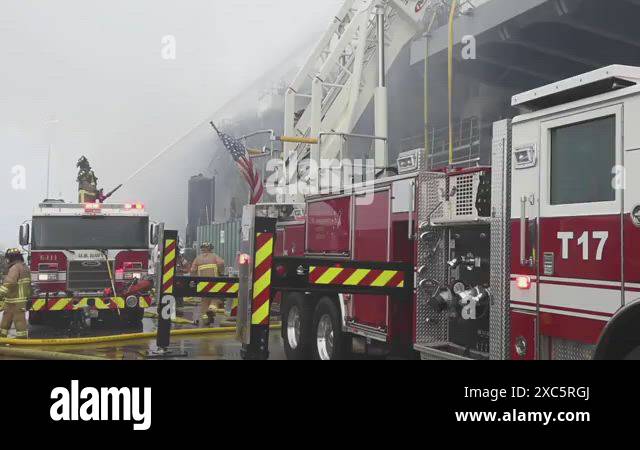 2020 Firetruck and crew fight a fire on amphibious assault ship USS ...