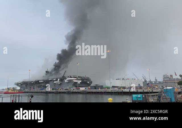 2020 Helicopters fight a fire aboard amphibious assault ship USS ...