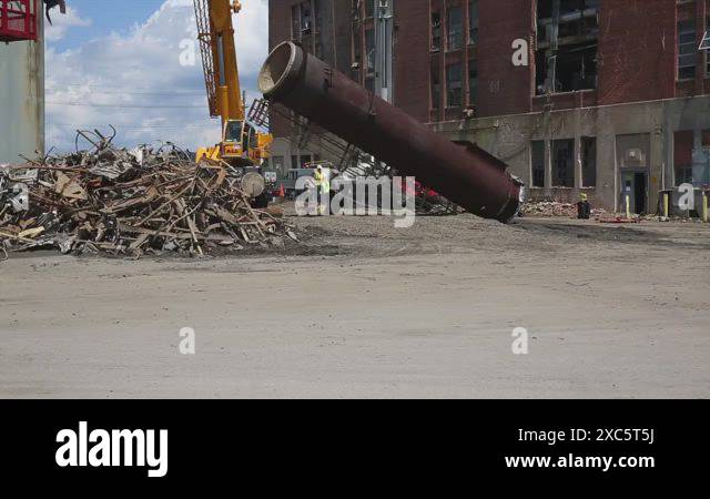 2020 Construction workers remove the smoke stacks during the historic ...