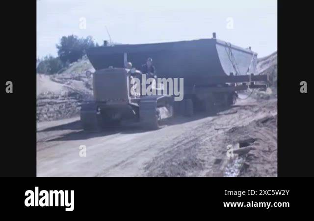 1943 - US Army engineers tow barges towards riverbanks for the Canol Project Stock Video Footage ...