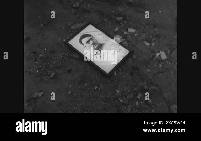 1945 - A US Army M-4 tank drives over a portrait of Hitler in Cologne ...