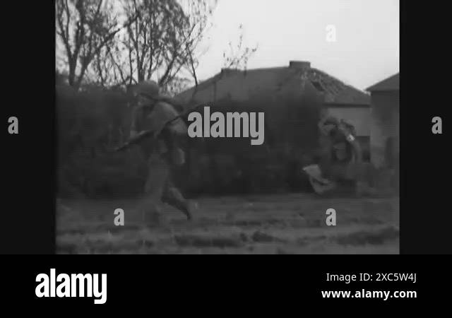 1944 - American soldiers advance across open country in Nazi Germany ...