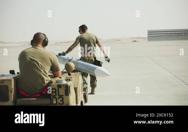 2021 332nd Air Expeditionary Wing Weapons airmen load missiles, fighter ...