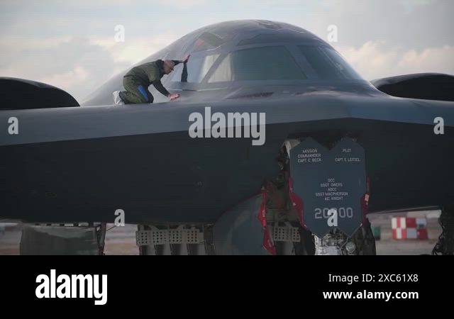 2021 A Northrop B-2 Spirit Stealth Bomber ground crew inspects and ...