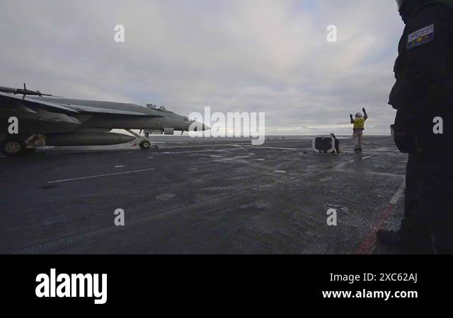 2021 U.S. Navy sailors conduct jet fighter plane operations on the ...