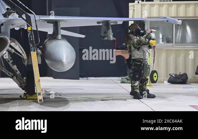 2022 8th Maintenance Group Airmen off-load a missile from a F-16 ...