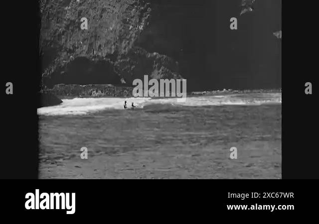 1945 - Surrendered Japanese soldiers swim to offshore LCI, climb onto ...