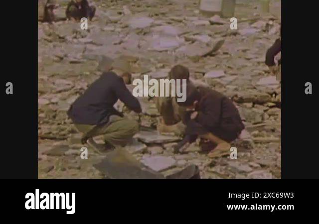HIROSHIMA - 1946 - Boys in war-torn Hiroshima, Japan use a rail spike ...