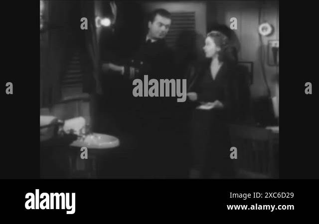 US - 1944 - in this drama, a ship captain lights a cigarette for a ...