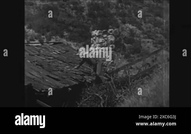 US - 1926 - in this silent western, a man jumps through the rickety ...