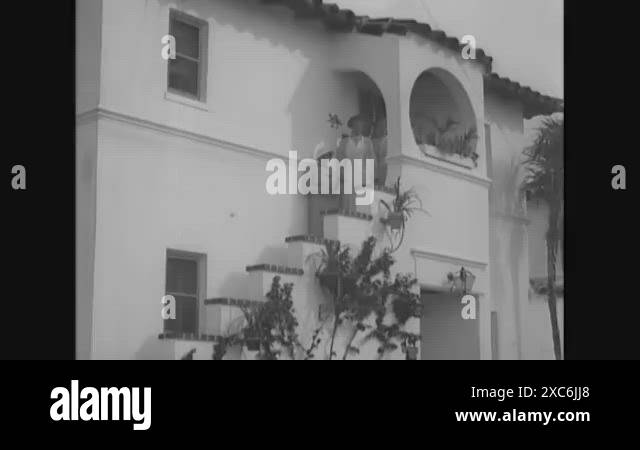 MIAMI - 1936 - Tourists walk through the Archway Ocean Villas resort in ...