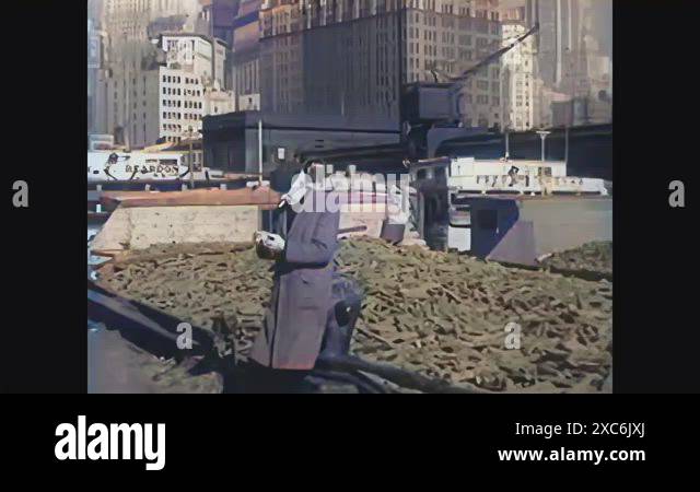 NEW YORK CITY - 1937 - Two young children play on the barge they were ...
