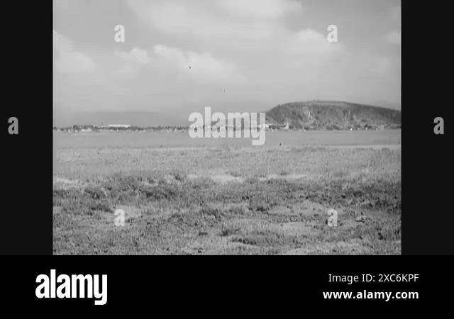 MEXICO - 1940 - Mexican Army tanks are driven towards a flat valley ...