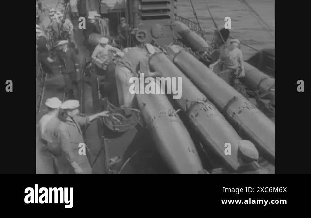 1954 - Men are working at torpedoes on the deck of a U-boat. A torpedo ...