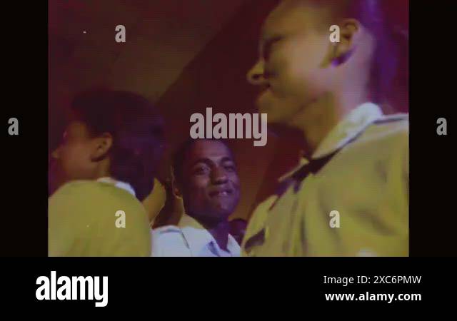 1980 - African-American servicemen are highlighted at a disco dance at ...