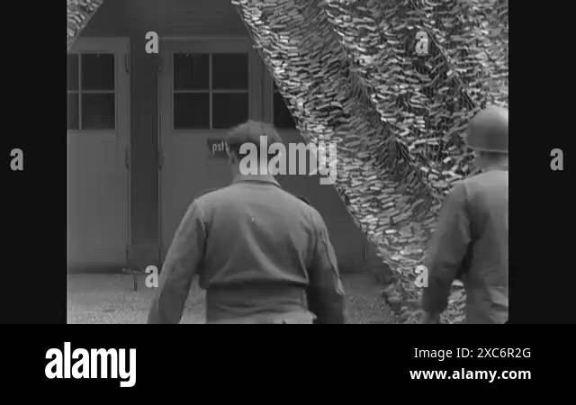 1945 - An American officer and two German prisoners walk into a ...