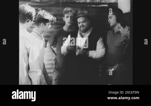 1961 - In this crime film, a fat man is counting money while a group of ...
