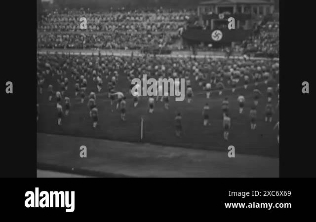 1932 - During a Nazi rally in a stadium in Berlin, Germany, athletes ...