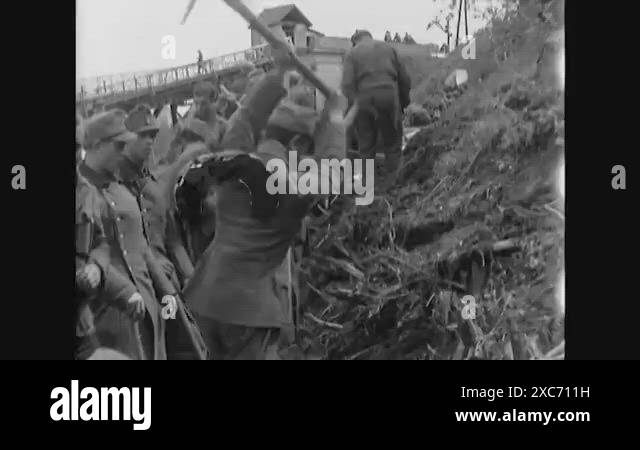 1945 - German POWs assist US Army engineers in building a pontoon ...