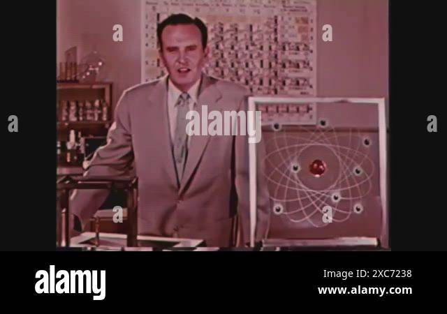 1956 - In this documentary, a man uses a diagram of an atom to explain ...