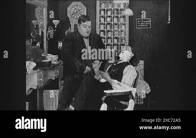 1916 - in this silent comedy, a janitor gives a customer at a hair ...
