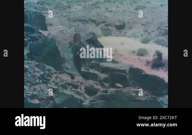 1977 - in this western, a teenage boy prepares a trap on a cliff. When ...