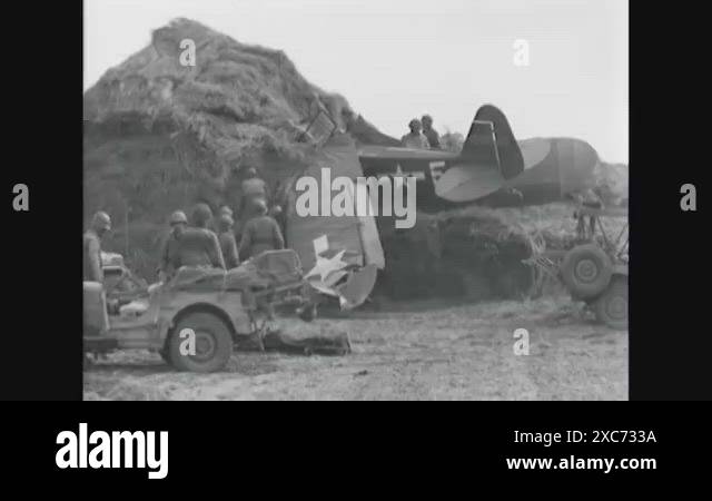 1945 - Soldiers rescue a pilot from a crashed plane in Germany during ...