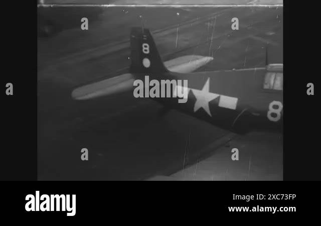 1944 - Small planes or warming up on the USS Hornet flight deck. A ...