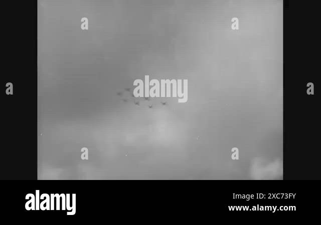 1944 - Formations of torpedo planes are passing in the sky. SB3C planes ...