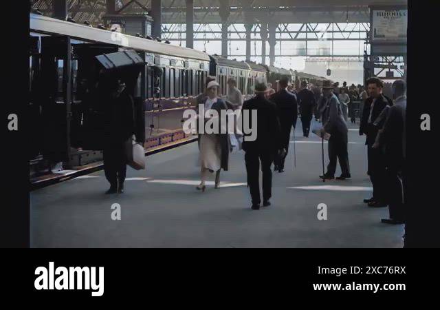 1943 - Passengers traverse a train platform in London, England Stock ...