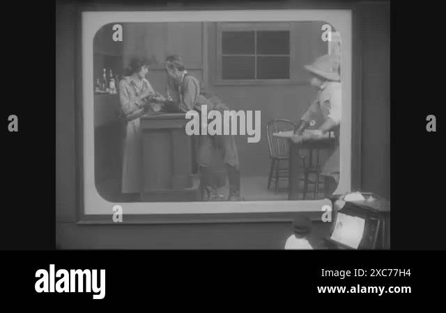 USA - 1916 - In this comedy film, a group of people sit in the theatre ...