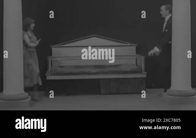 USA - 1915 - A couple begins demonstrating how to dance the maxixe ...