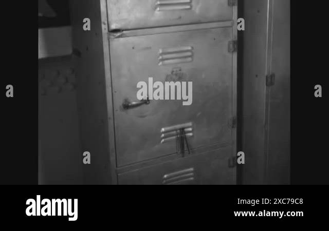 1944- Soap and towel are removed from ship locker, showing pinup photos ...
