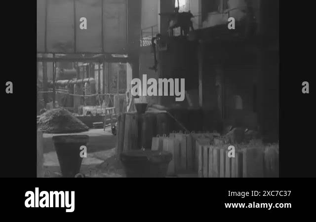 CHINA - 1944 - Chinese workers feed the furnaces in a steel mill Stock ...