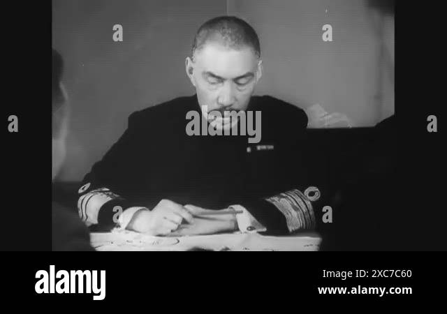 CHINA - 1944 - Chinese military officers share ideas over a map with He ...