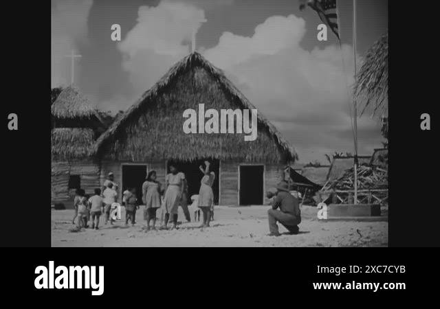 GUAM - 1945 - A combat cameraman with the US Marines photographs young ...