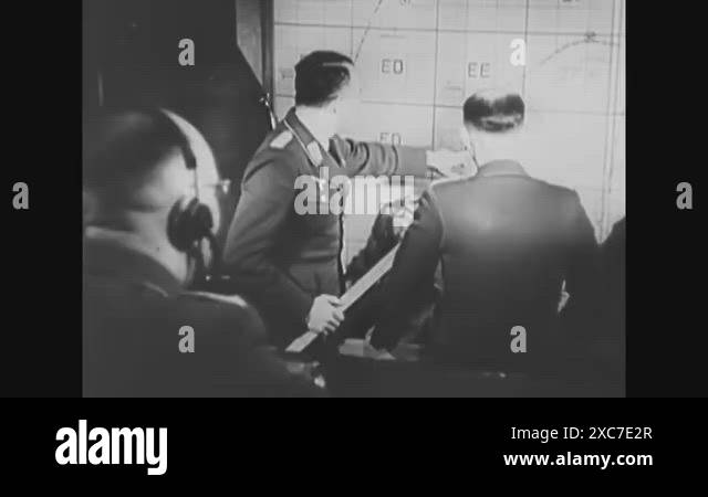 GERMANY - 1944 - German officers turn on an air raid siren, alerting ...