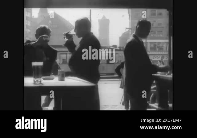 BERLIN - 1932 - People ride an elevated train or double-decker bus in ...