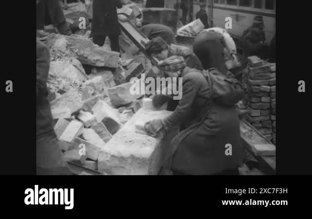 GERMANY - 1947 - Men walk around the wreckage of a bombed city in the ...