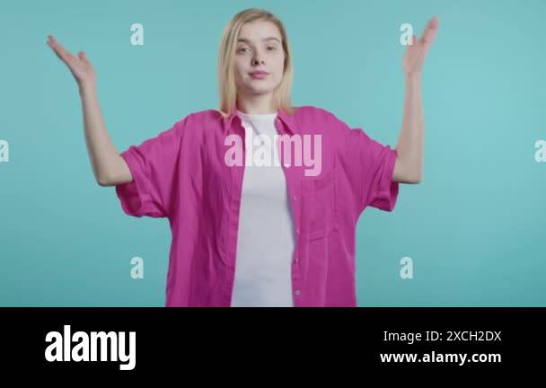 Confused casual woman, shoulders up - cant help, makes gesture of I ...