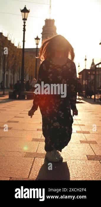 Happy cute girl having fun outdoor at city streets urban background ...