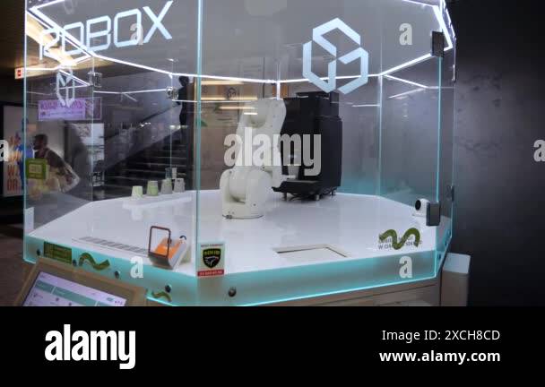 Warsaw, Poland - May 03, 2024 Modern robotic coffee shop, robot arm ...